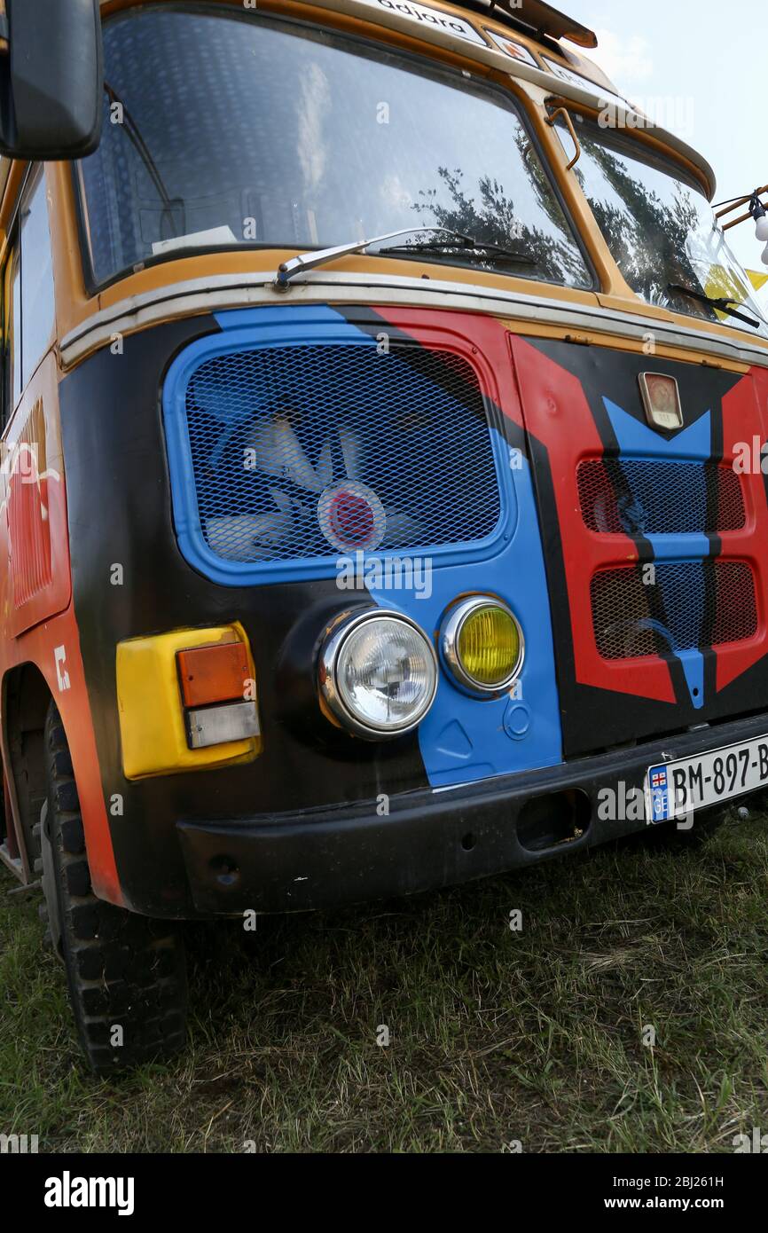 Audience with hands raised at a music festival and lights streaming ...