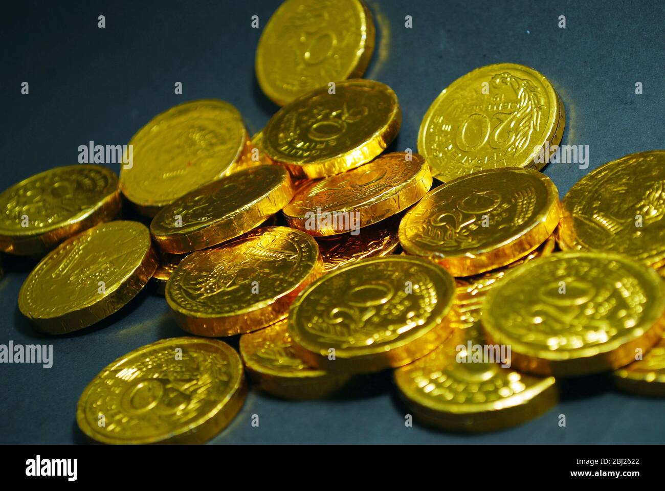 Gold coin chocolate food replica Stock Photo - Alamy