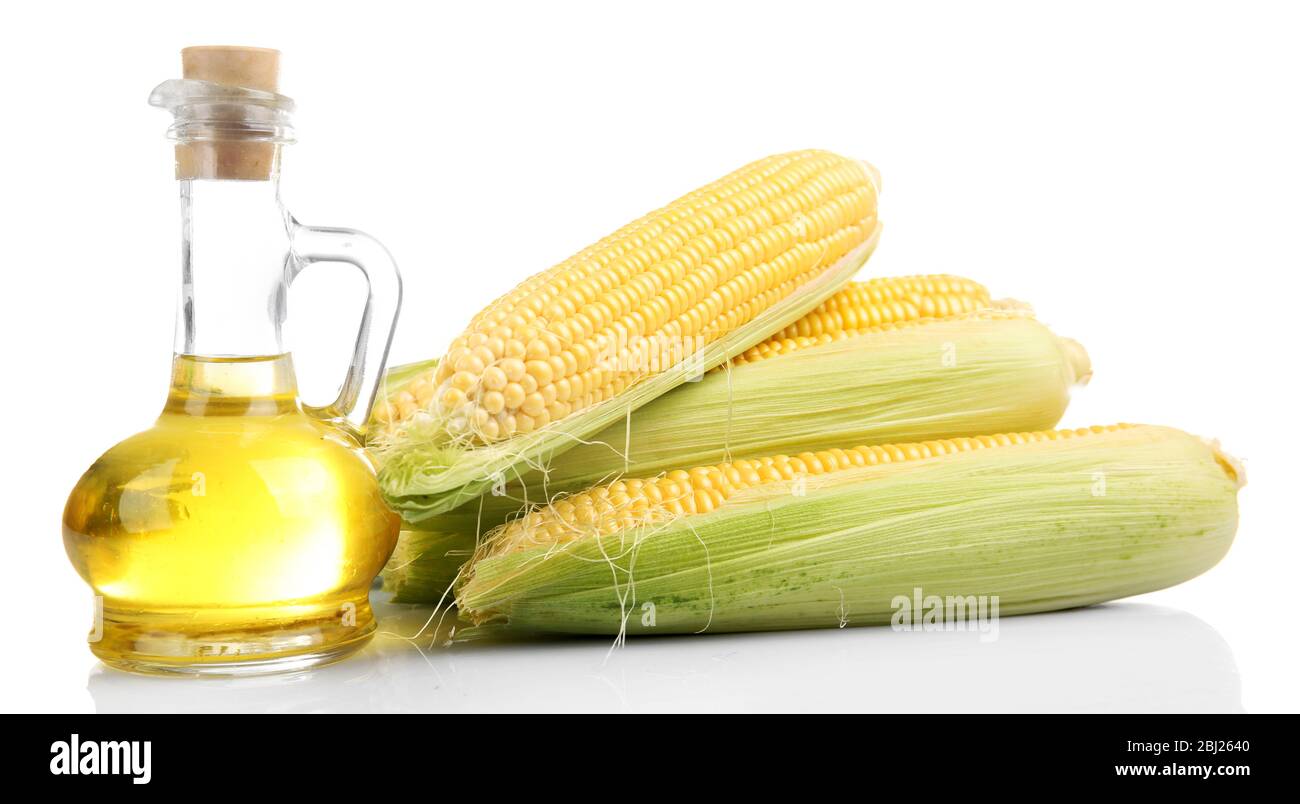 Fresh corn with bottle of oil isolated on white Stock Photo - Alamy