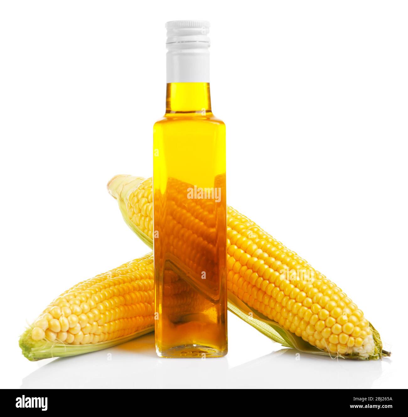Fresh corn with bottle of oil isolated on white Stock Photo - Alamy
