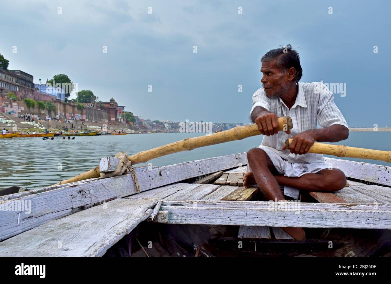 Oarsman on the a boat ride in Ganges, Varanasi Stock Photo - Alamy