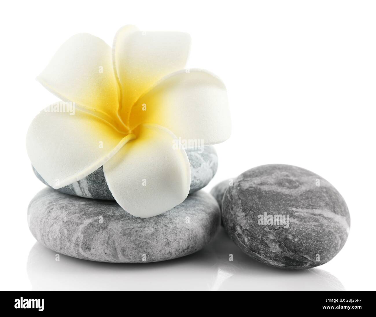 Stack of spa stones isolated on white Stock Photo - Alamy