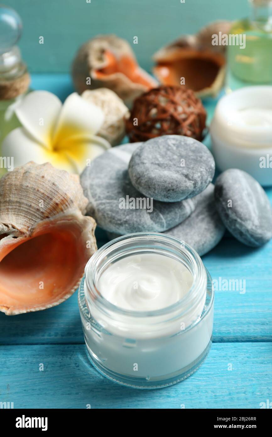 Stack of spa stones and spa treatments on color wooden background Stock ...