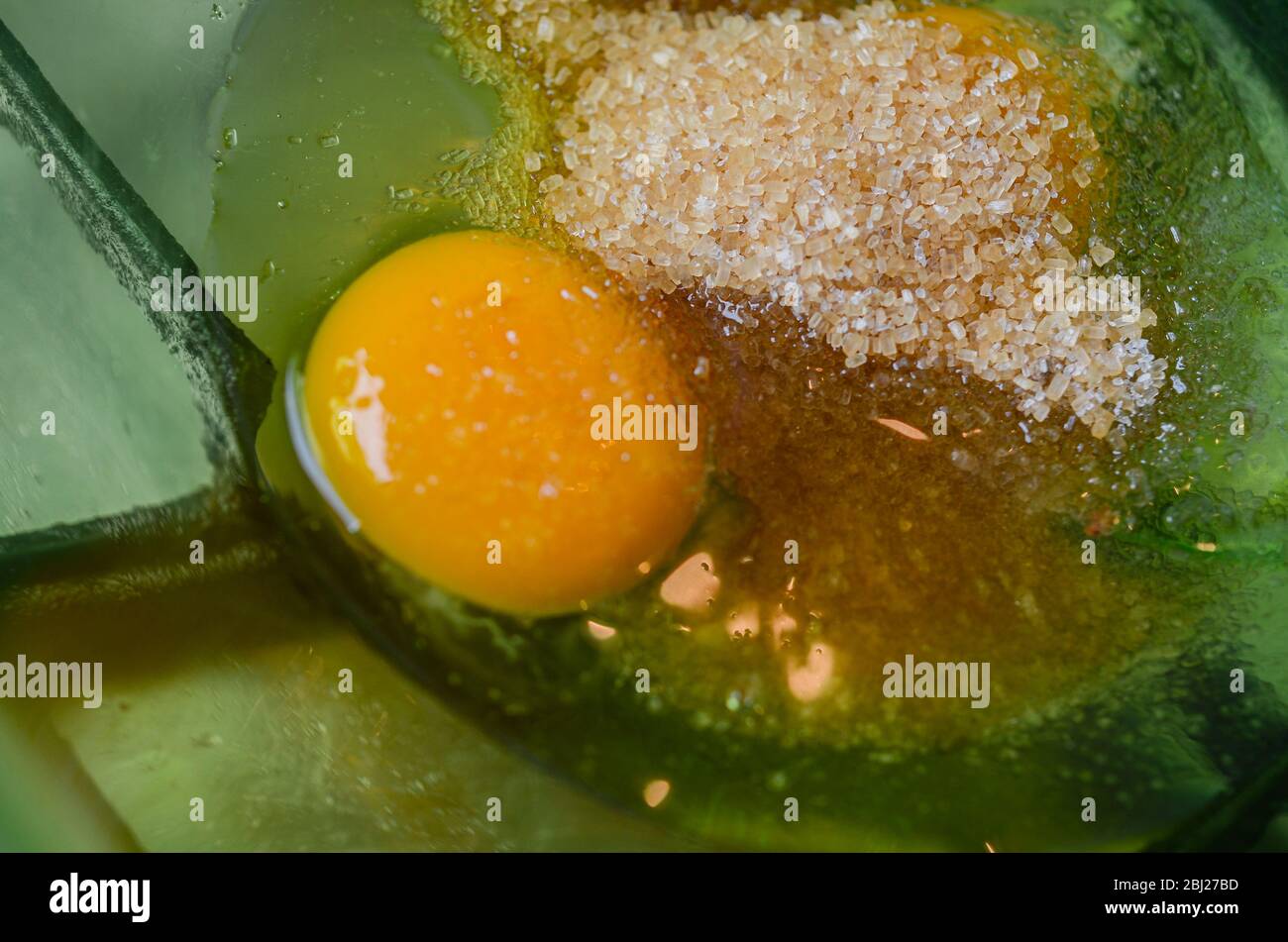 Mxing eggs with sugar , flour and butter to bake a cake Stock Photo - Alamy