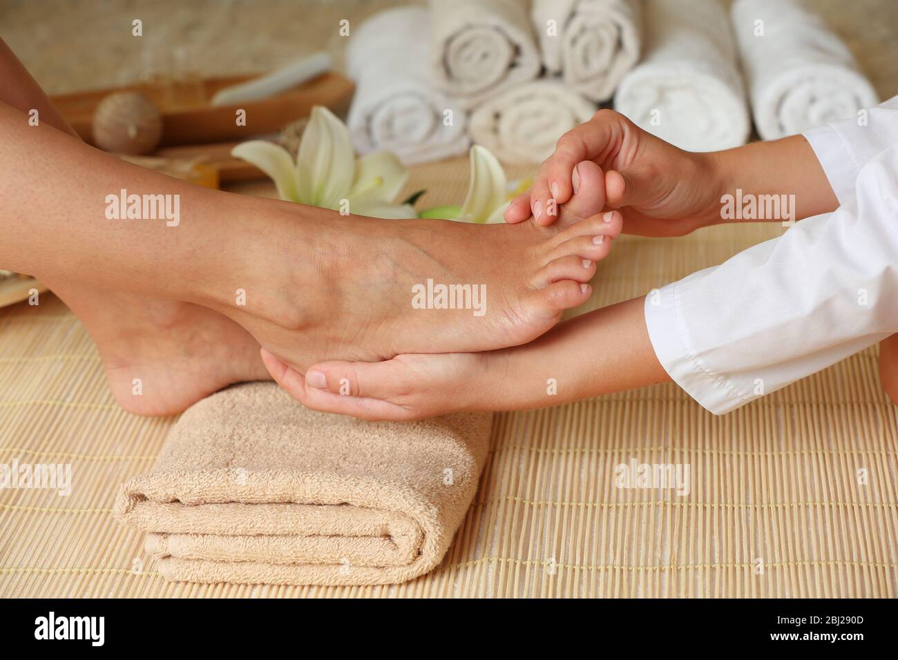 Masseur making feet massage hi-res stock photography and images - Alamy