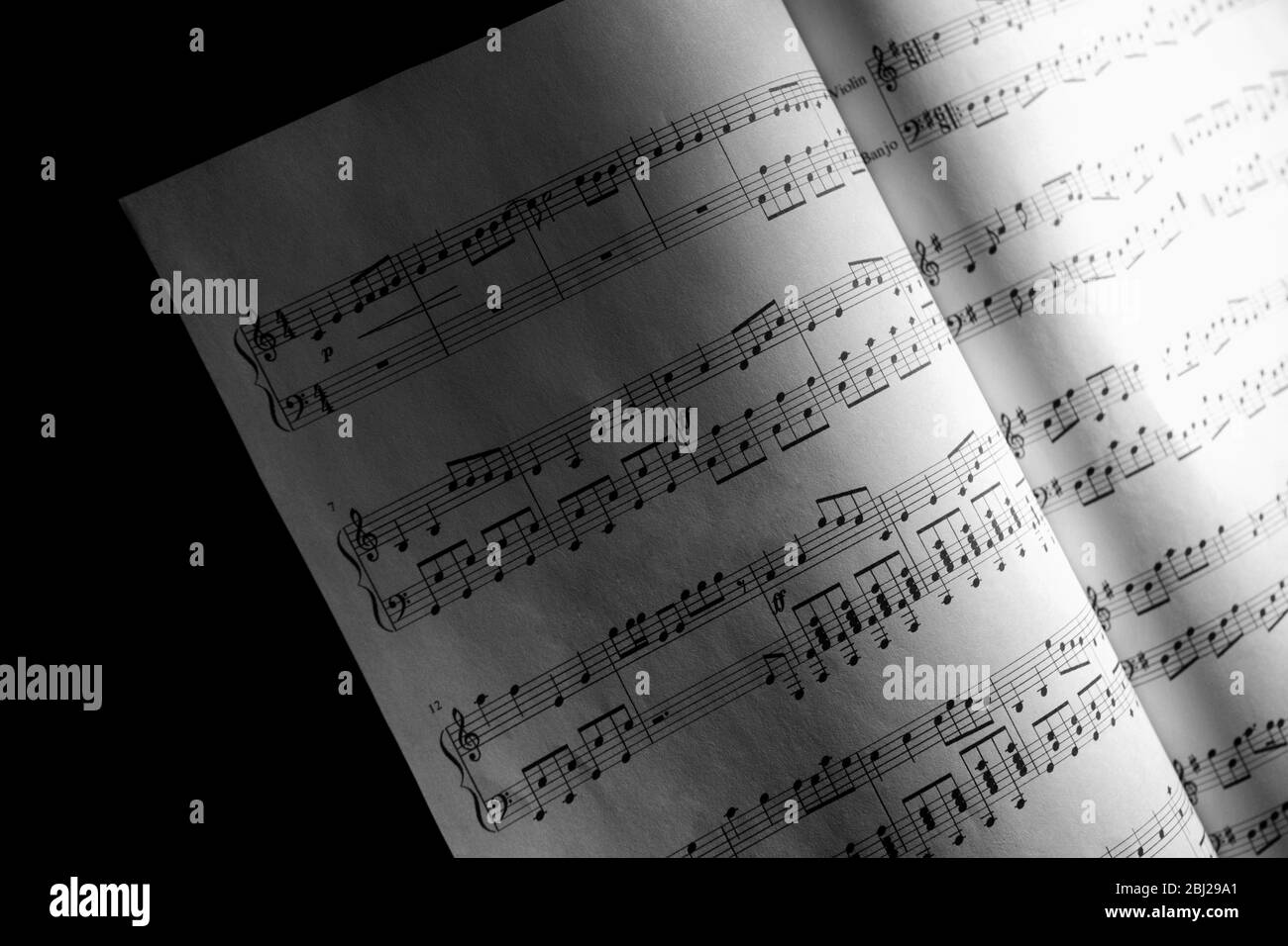 Music sheets in the shadow, closeup Stock Photo - Alamy