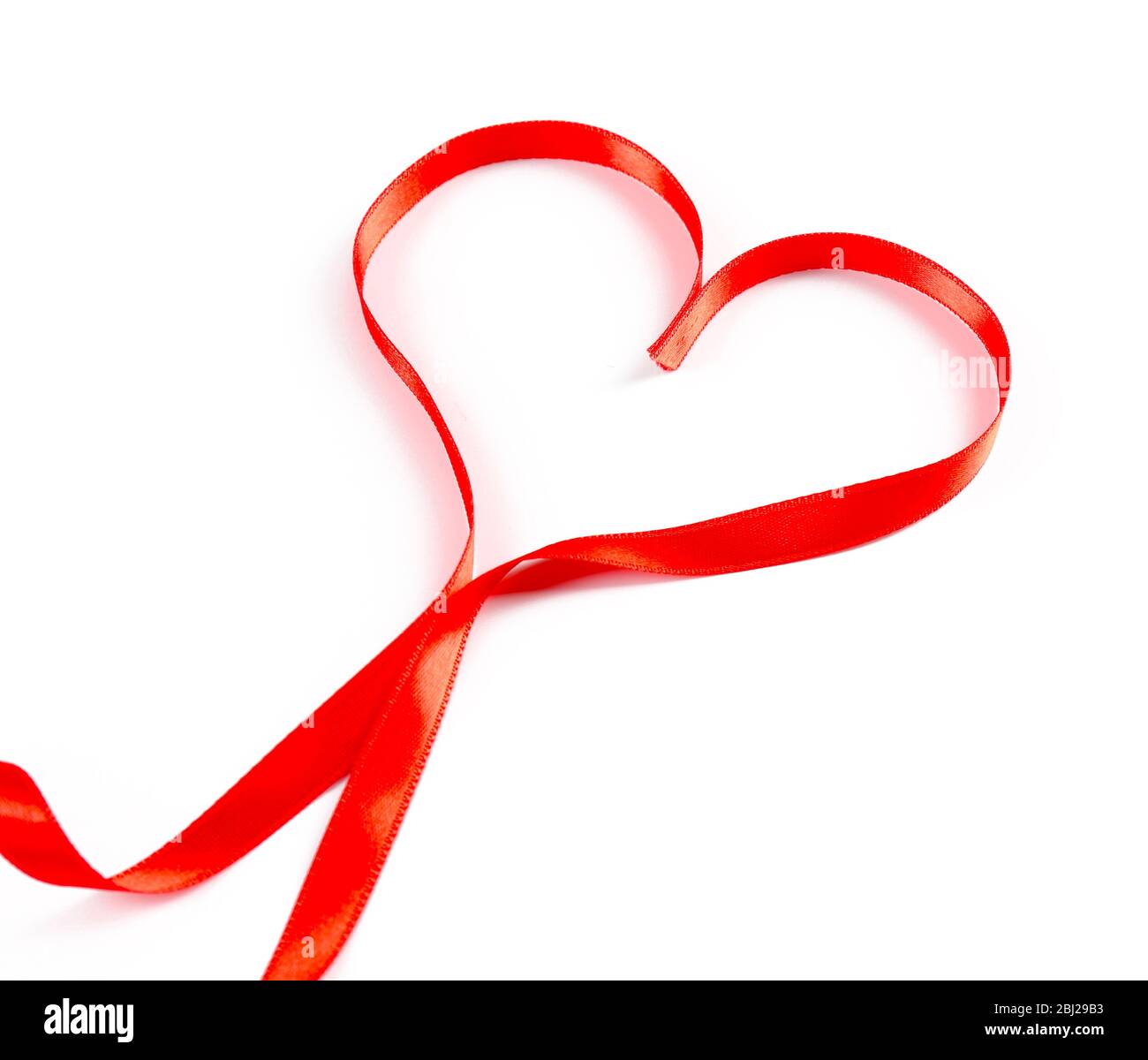 Red heart ribbon isolated on white Stock Photo - Alamy
