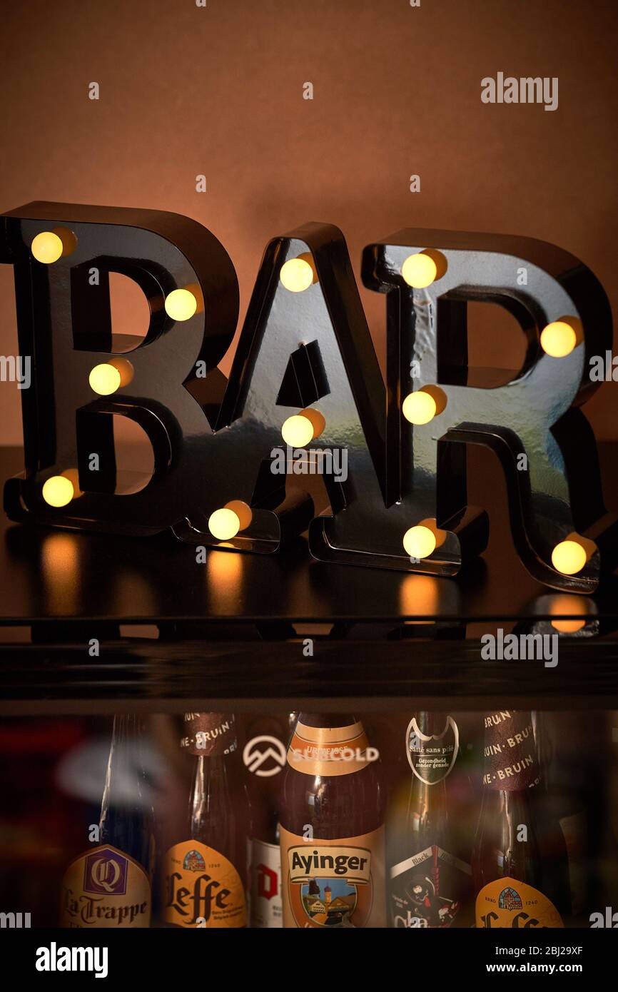 Bar sign in lights sitting on beer fridge Stock Photo - Alamy