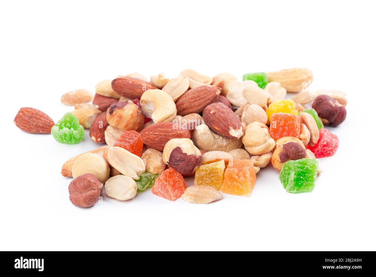 Pile of toasted nuts and candied fruit isolated on white background ...