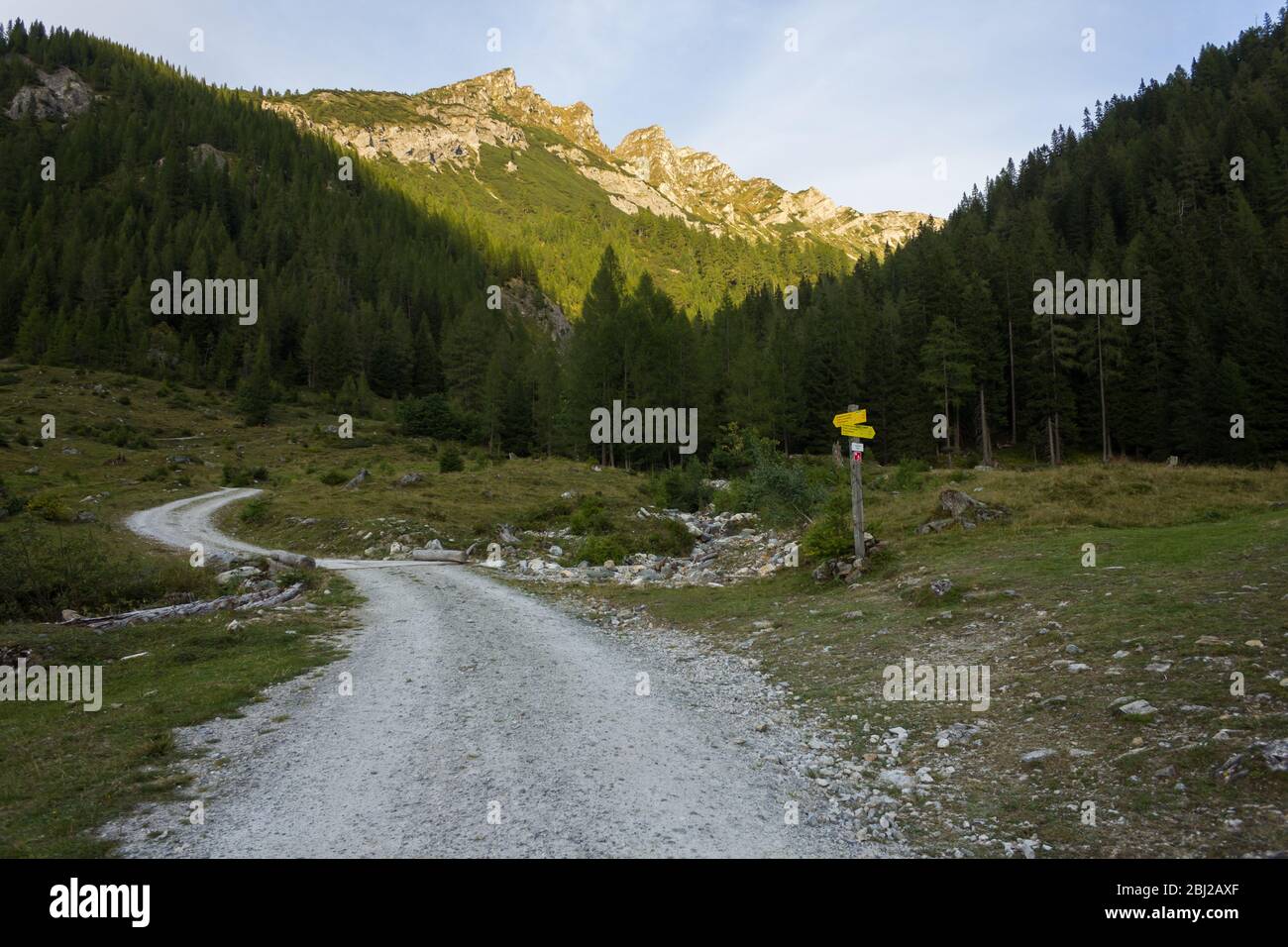 Beautiful sunset in the Alps with hiking trail Stock Photo - Alamy
