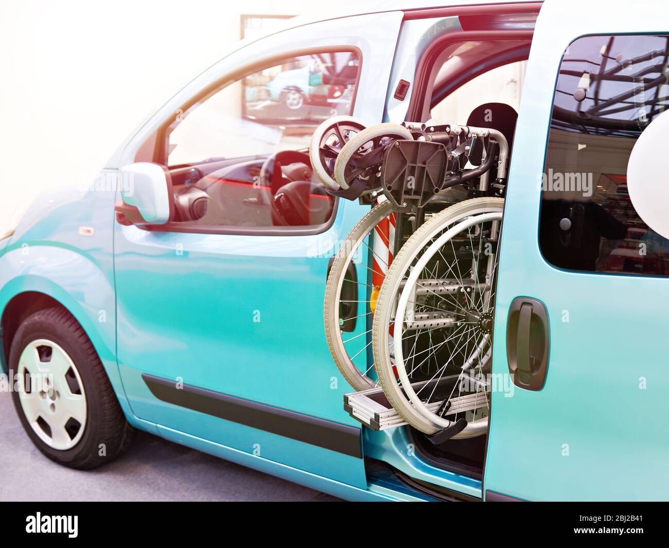 Wheelchair folded in the car Stock Photo - Alamy