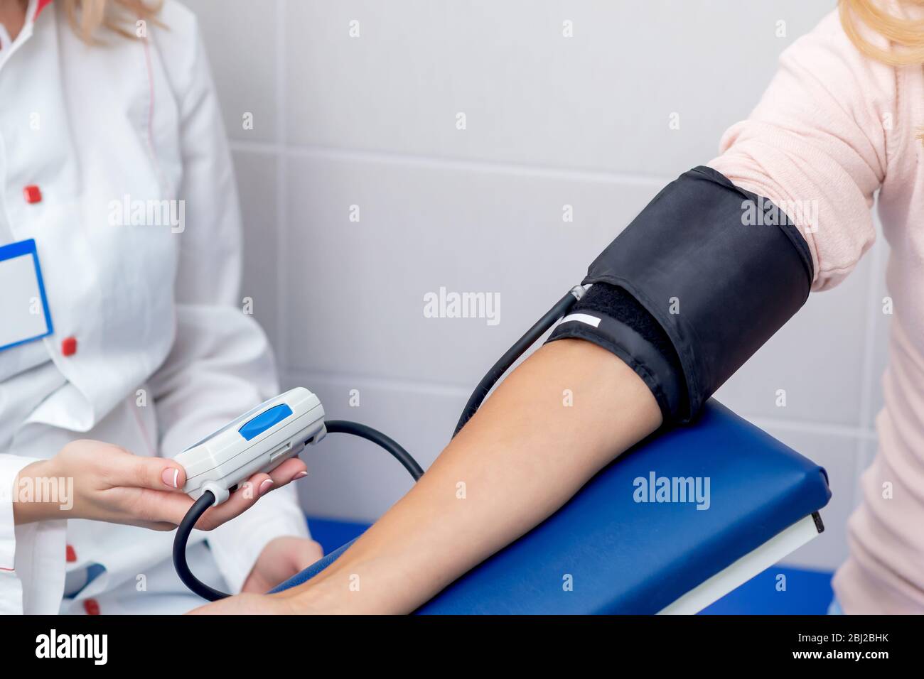 Nurse hand is measuring the pressure on arm in the hospital Stock Photo ...