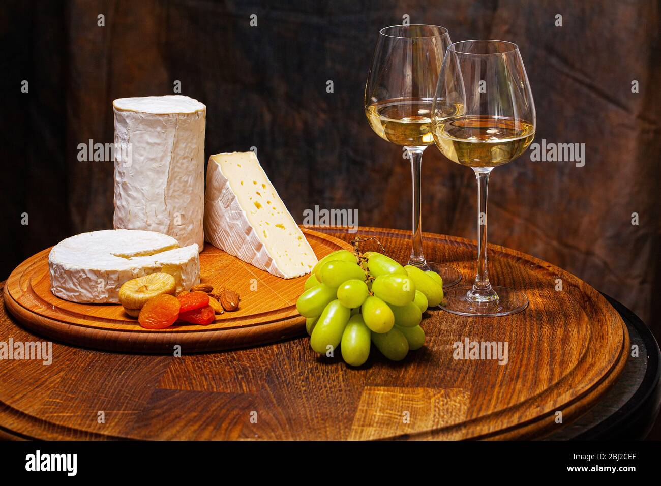 Cheese of elite variety sliced on a wooden board Stock Photo - Alamy