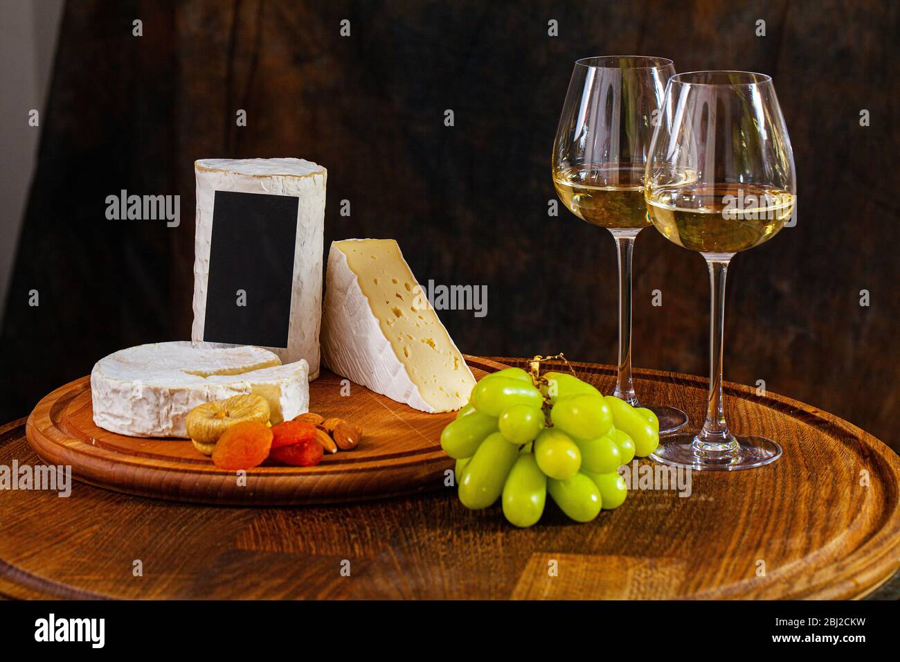 Cheese of elite variety sliced on a wooden board Stock Photo - Alamy