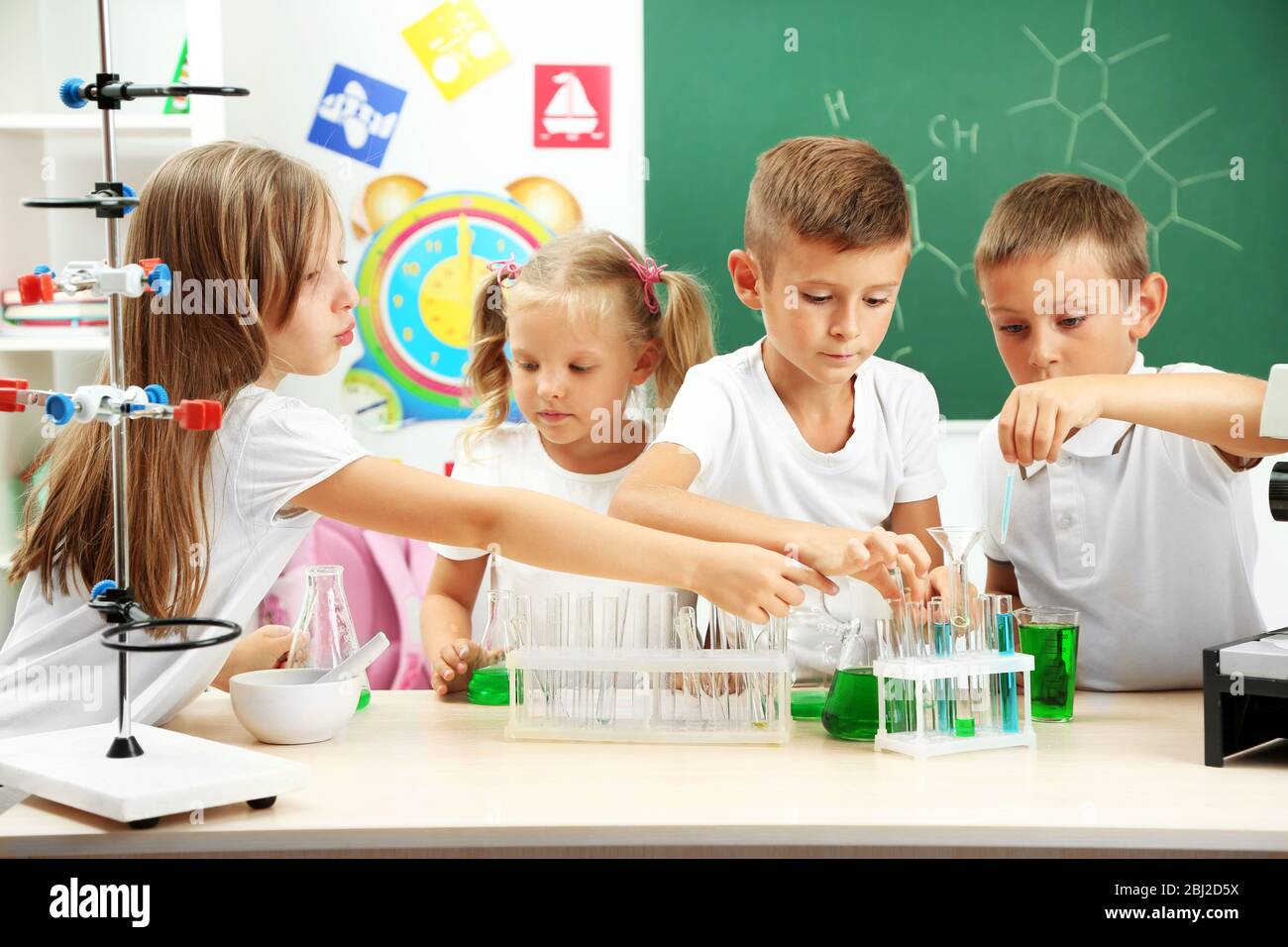 Cute pupils doing biochemistry research in chemistry class Stock Photo ...