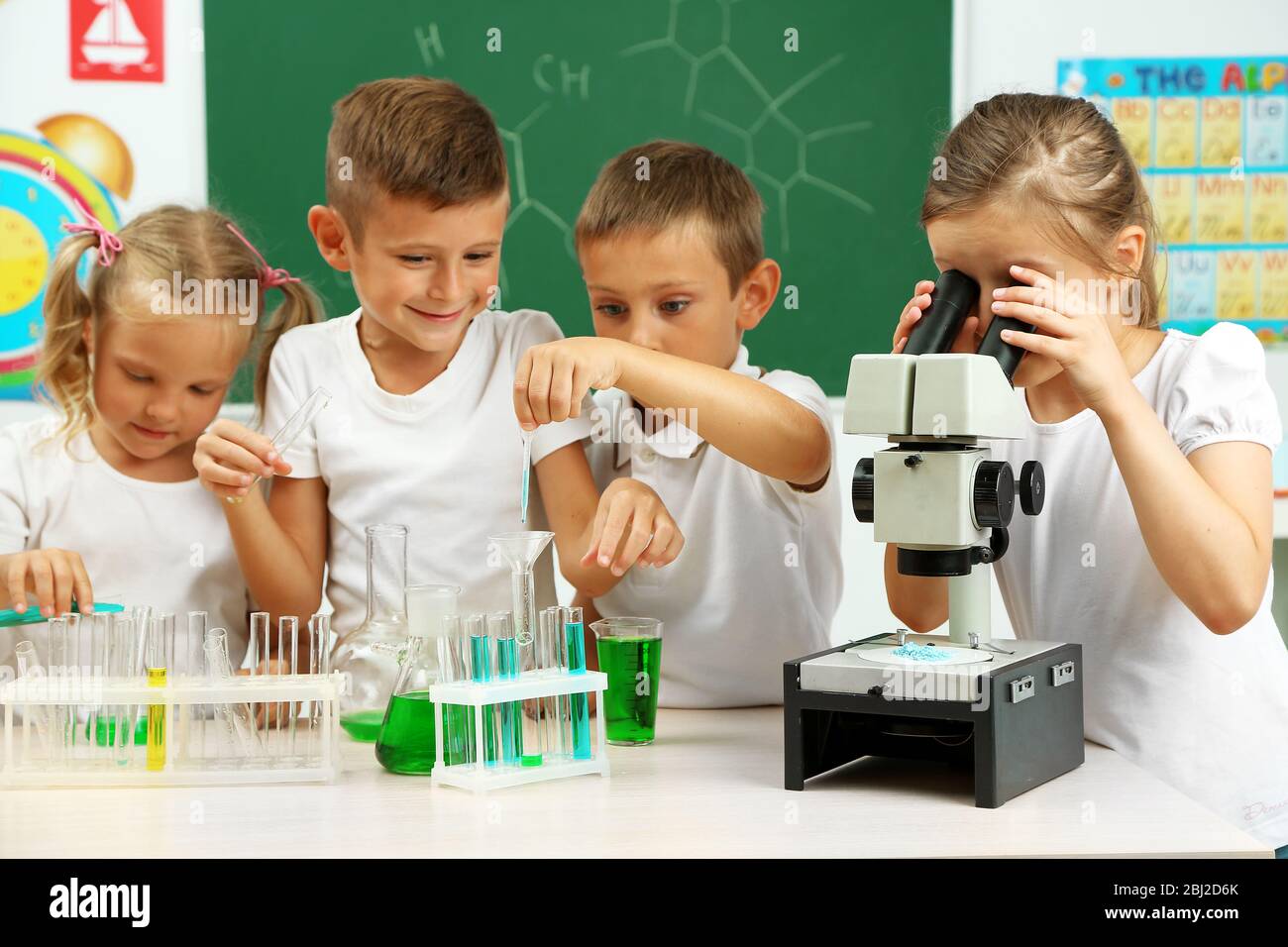 Cute pupils doing biochemistry research in chemistry class Stock Photo ...