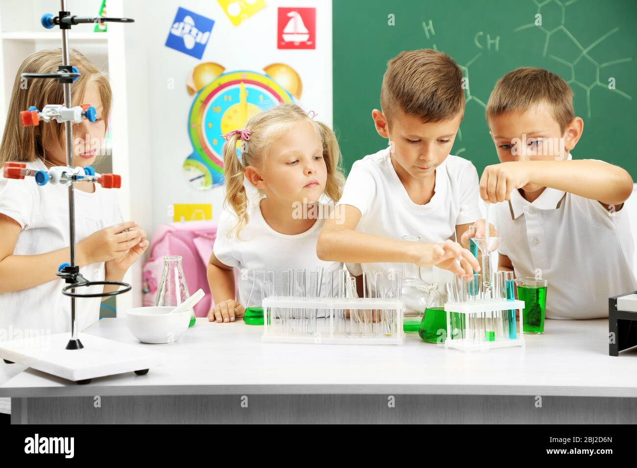 Cute pupils doing biochemistry research in chemistry class Stock Photo ...
