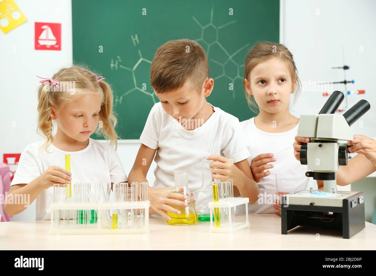 Cute pupils doing biochemistry research in chemistry class Stock Photo ...