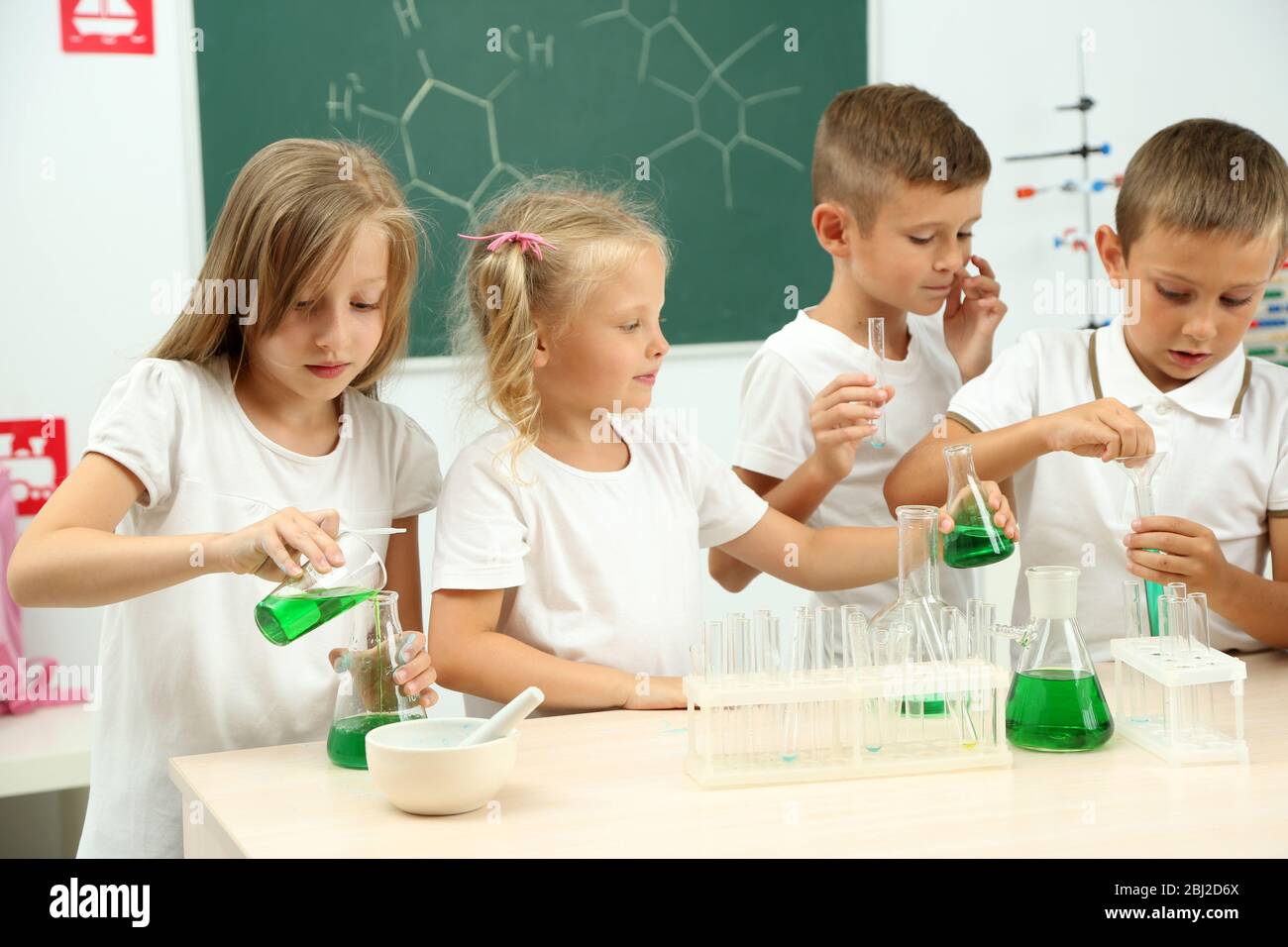 Cute pupils doing biochemistry research in chemistry class Stock Photo ...