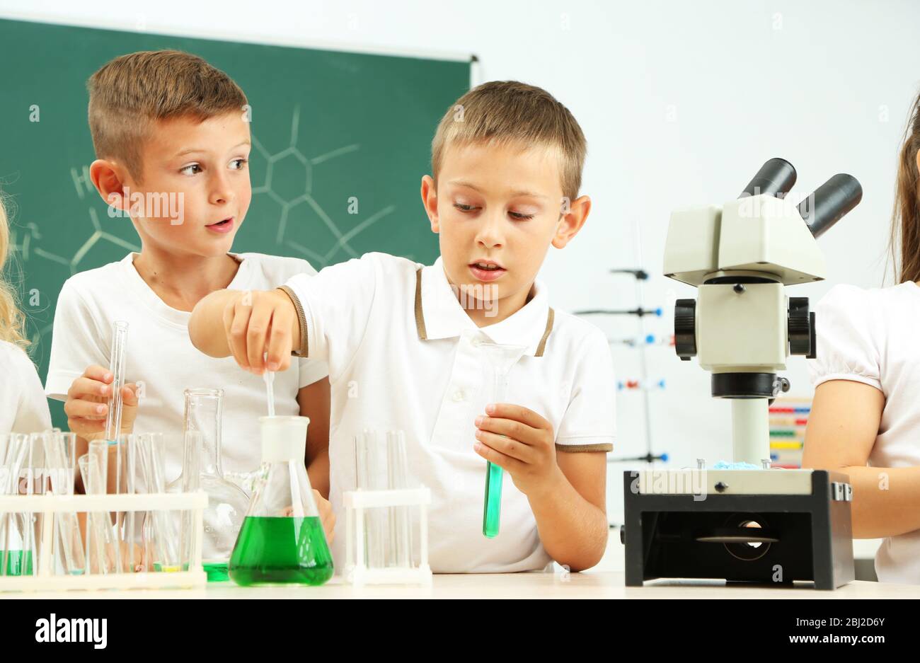 Cute pupils doing biochemistry research in chemistry class Stock Photo ...
