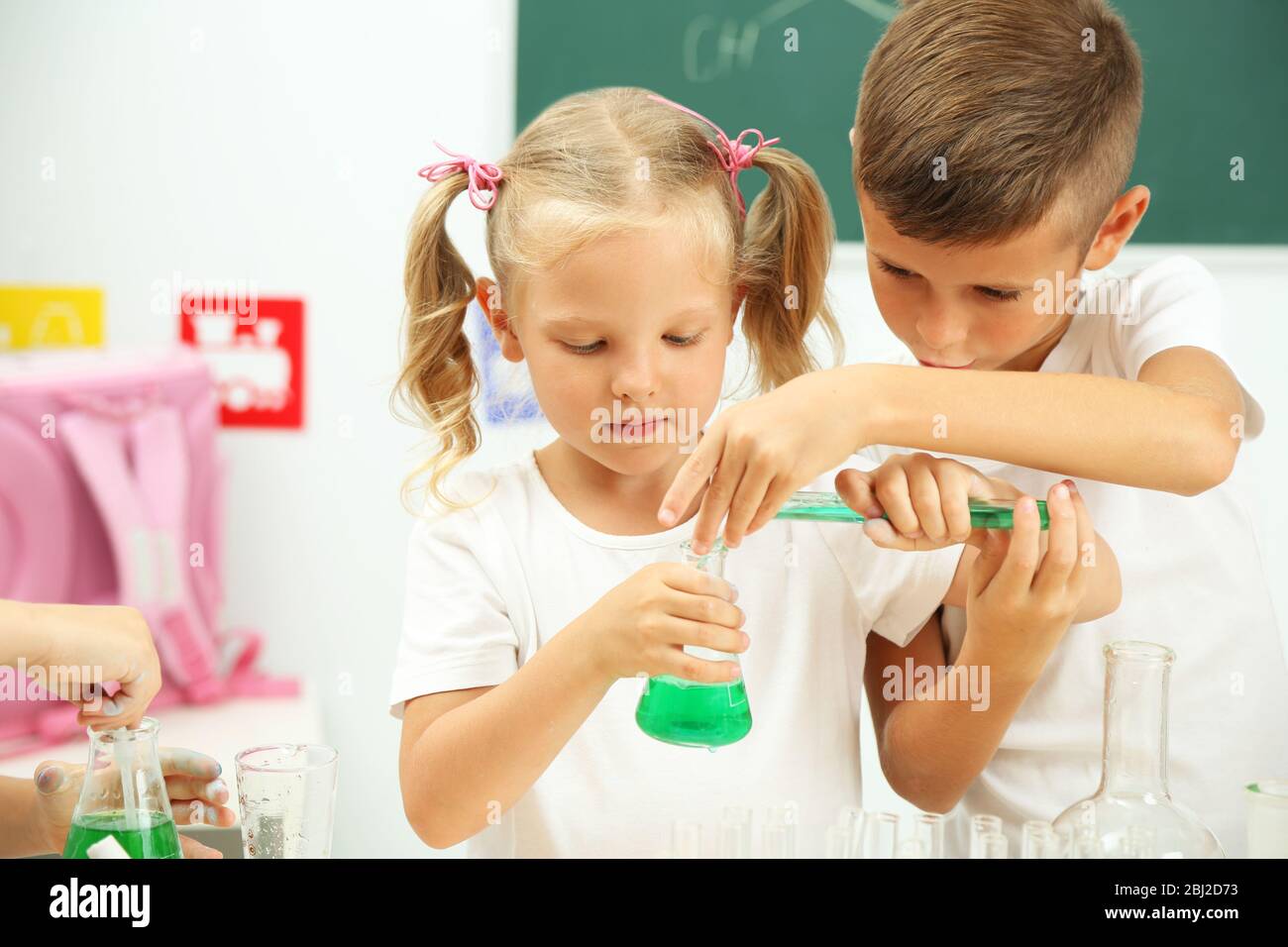 Cute pupils doing biochemistry research in chemistry class Stock Photo ...