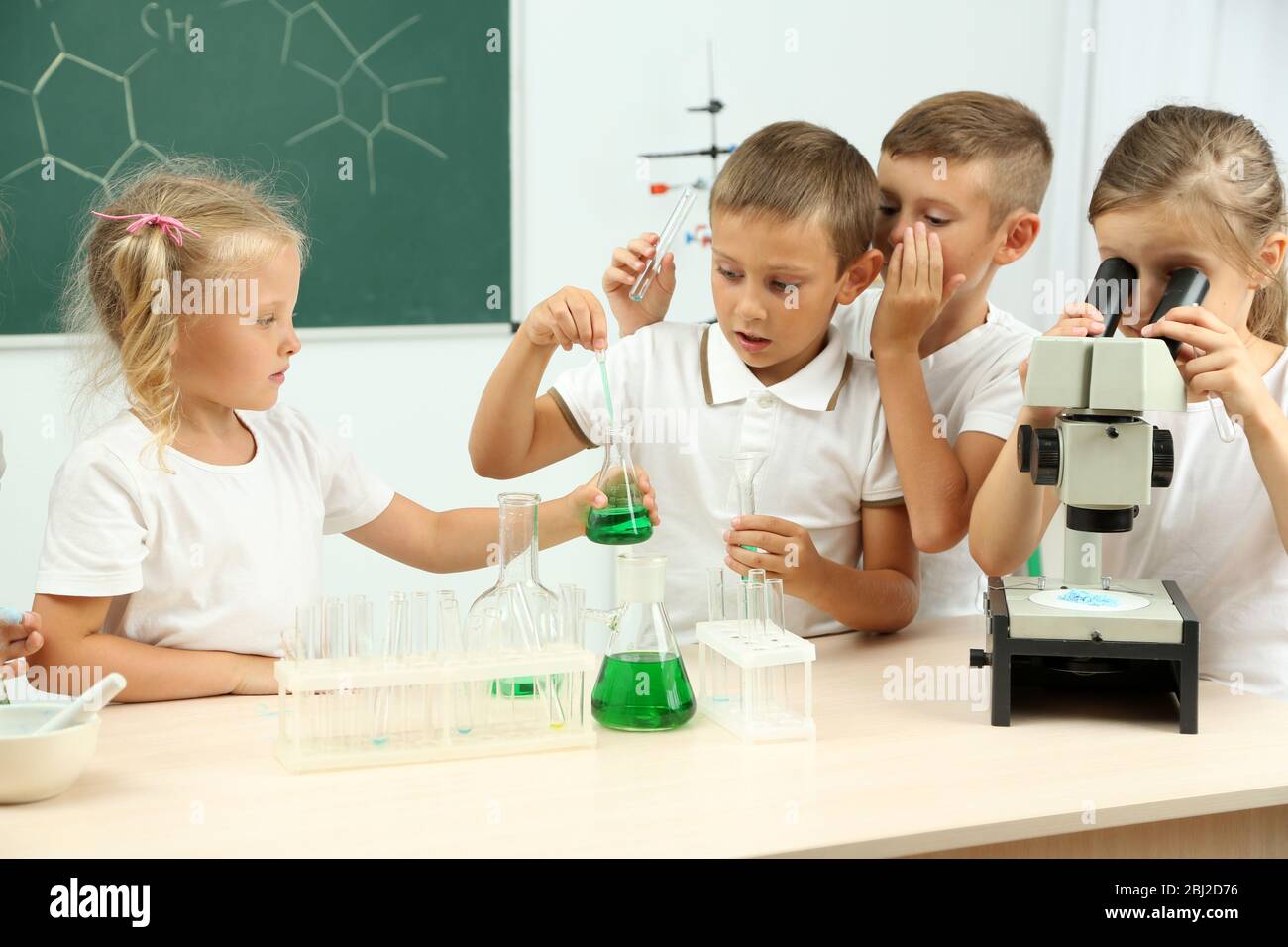 Cute pupils doing biochemistry research in chemistry class Stock Photo ...