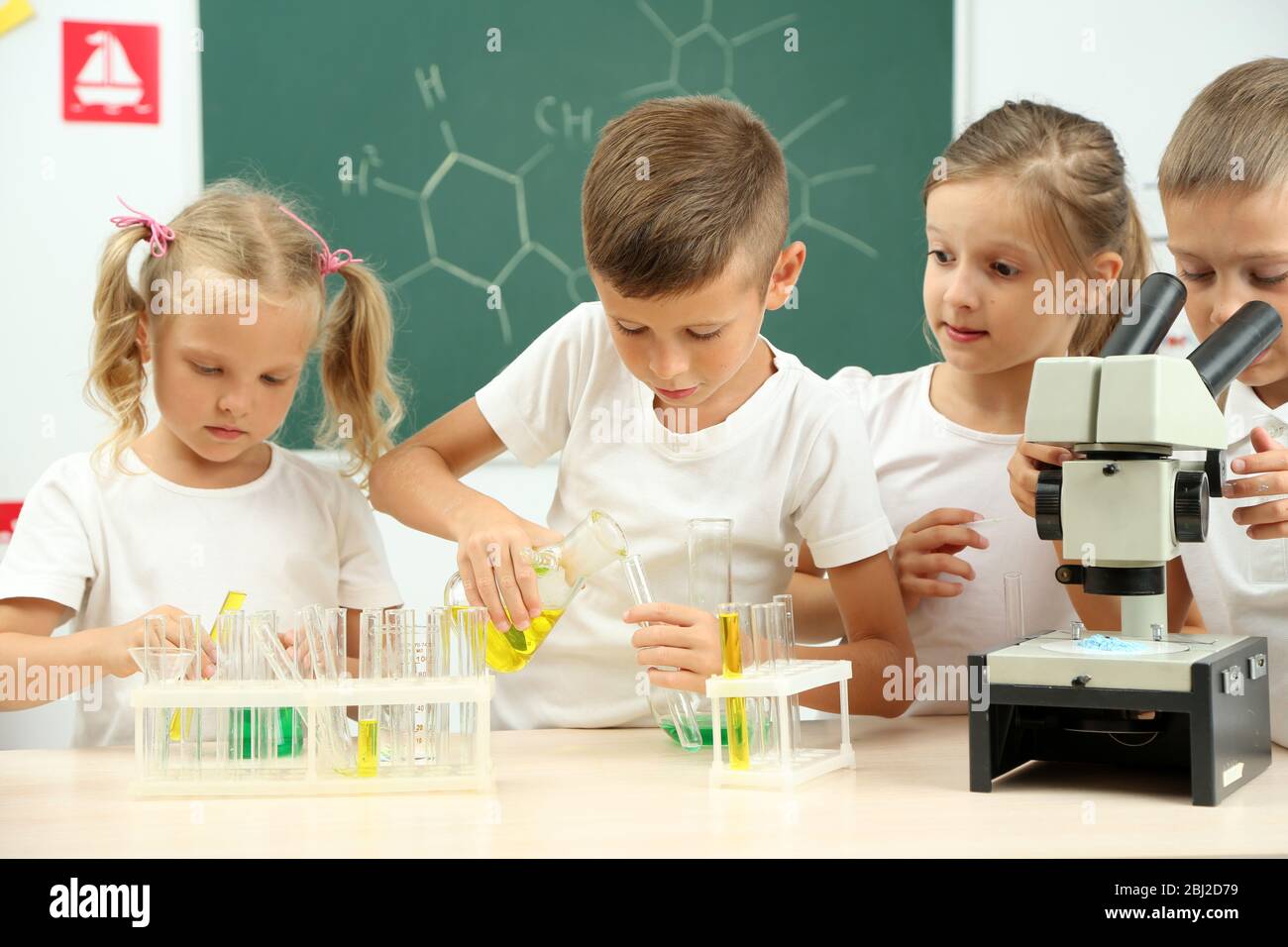 Cute pupils doing biochemistry research in chemistry class Stock Photo ...