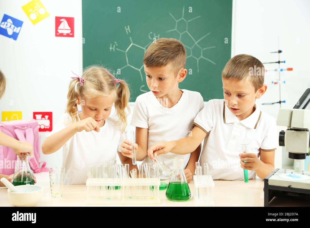 Cute pupils doing biochemistry research in chemistry class Stock Photo ...