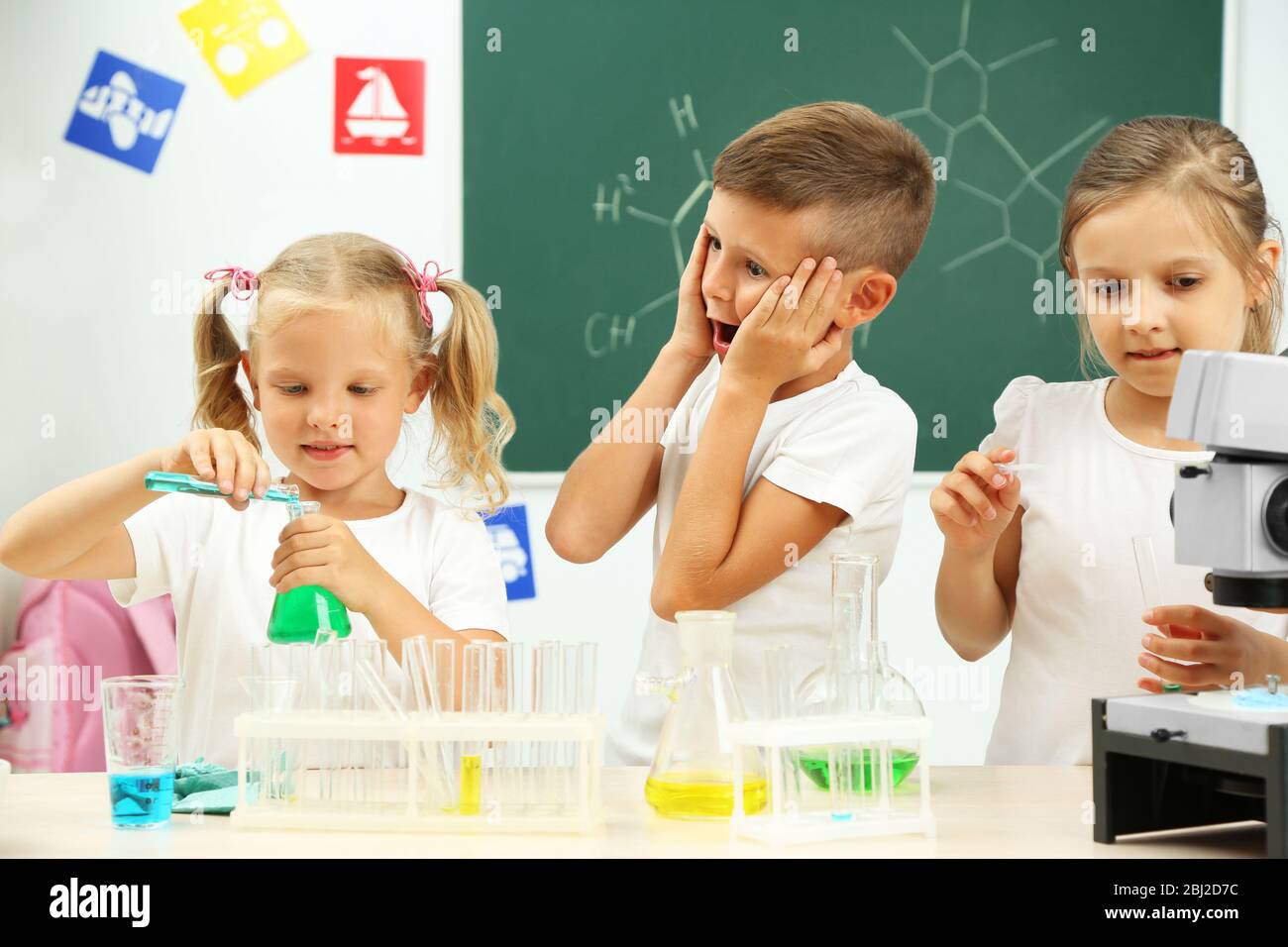 Cute pupils doing biochemistry research in chemistry class Stock Photo ...