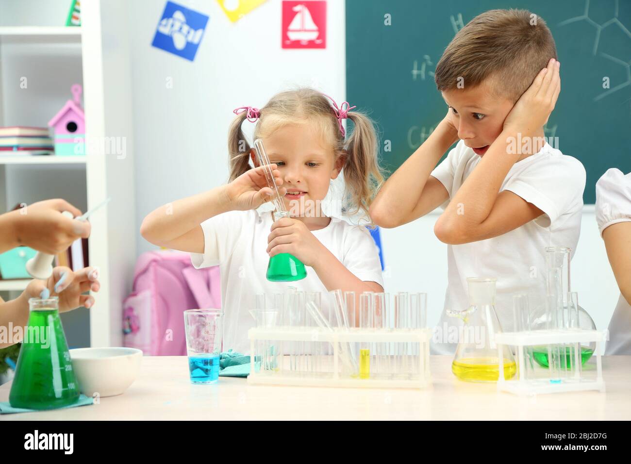 Cute pupils doing biochemistry research in chemistry class Stock Photo ...