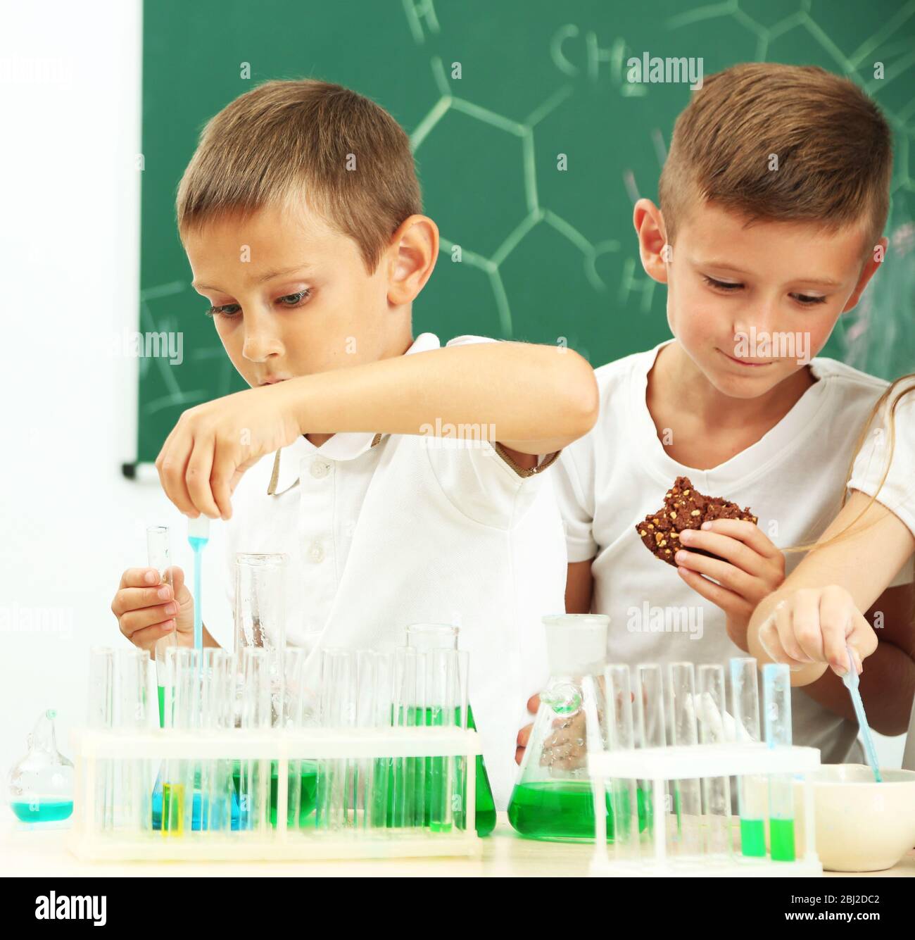 Cute pupils doing biochemistry research in chemistry class Stock Photo ...