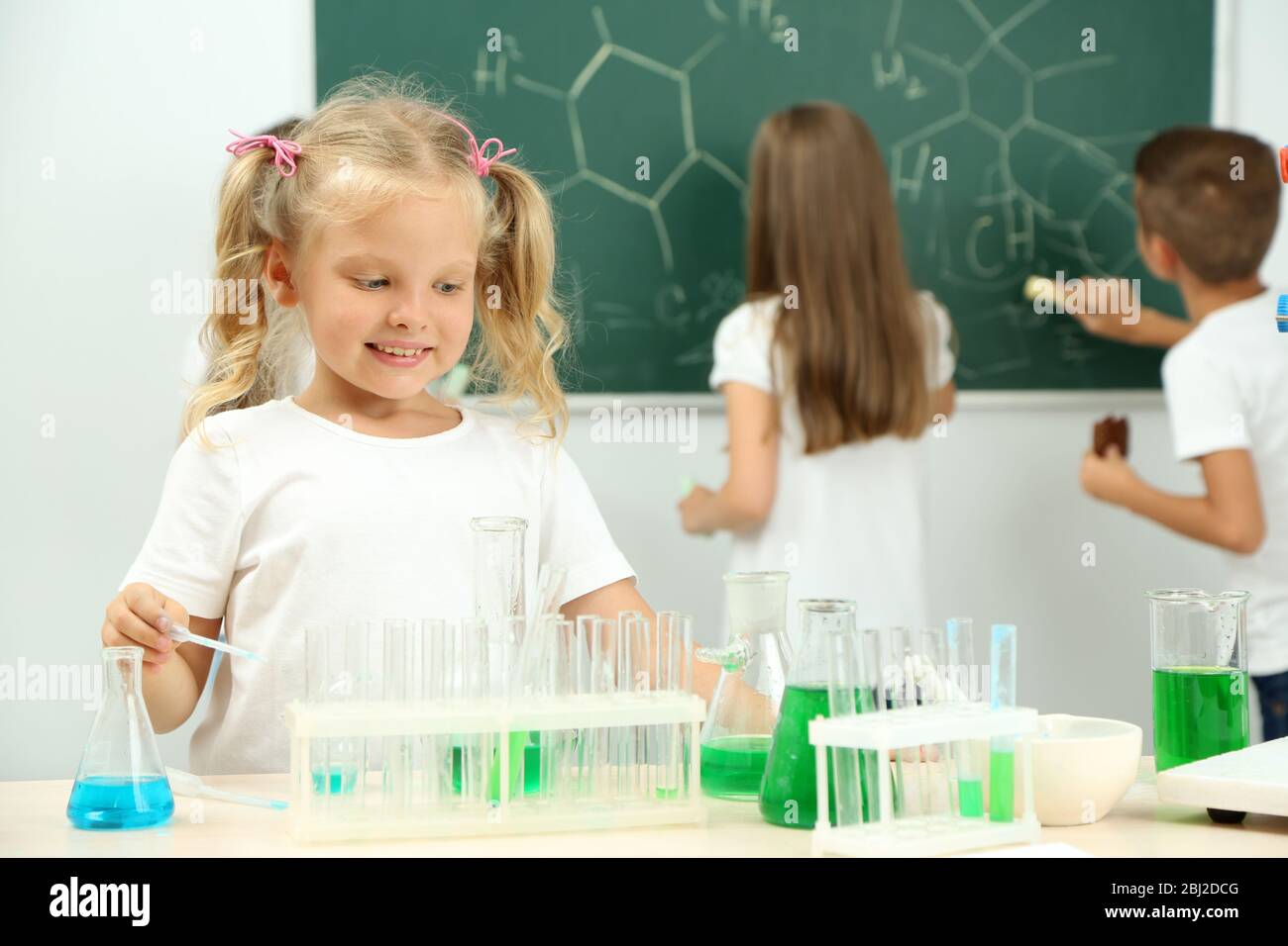Cute pupils doing biochemistry research in chemistry class Stock Photo ...