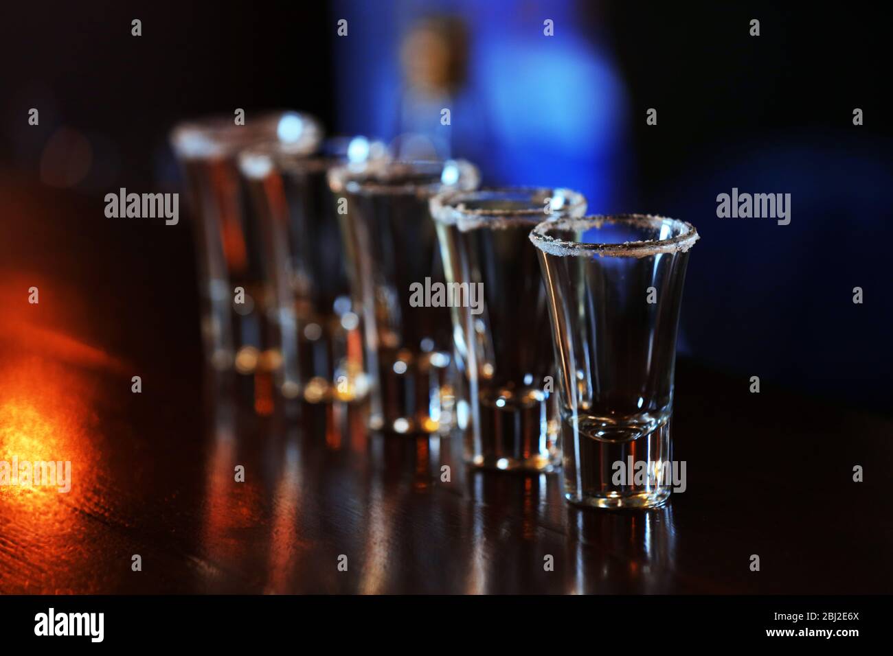 Empty shot glasses on bar counter Stock Photo - Alamy