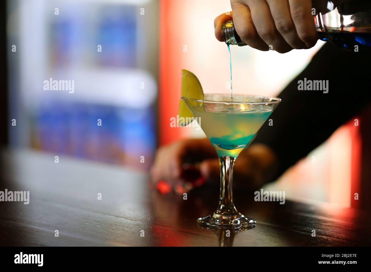 Bartender making cocktail Stock Photo - Alamy