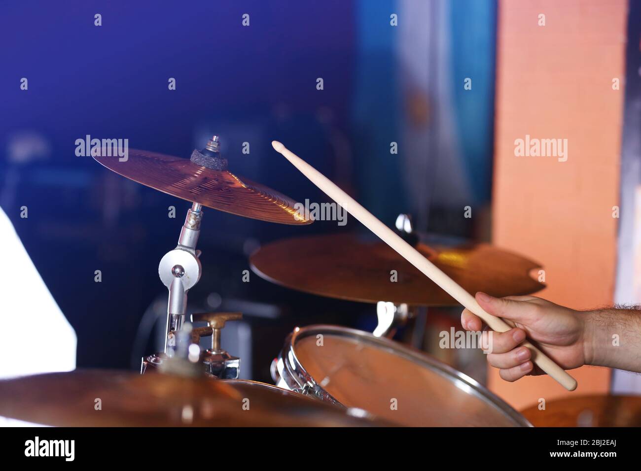 Hand of drummer with sticks and drums, close-up Stock Photo - Alamy