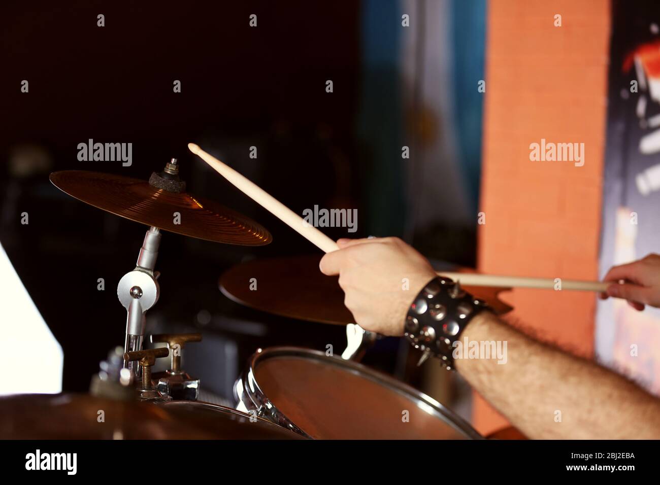 Hand of drummer with sticks and drums, close-up Stock Photo - Alamy