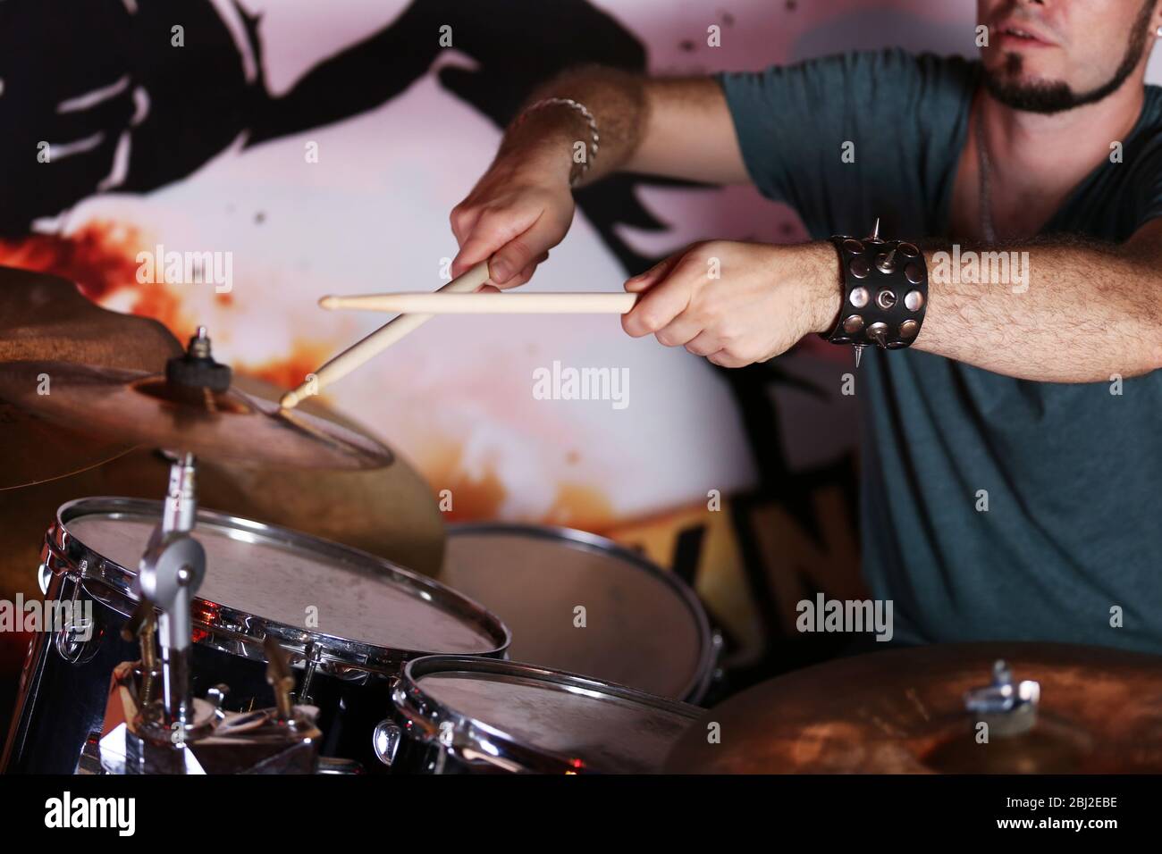 Hand of drummer with sticks and drums, close-up Stock Photo - Alamy
