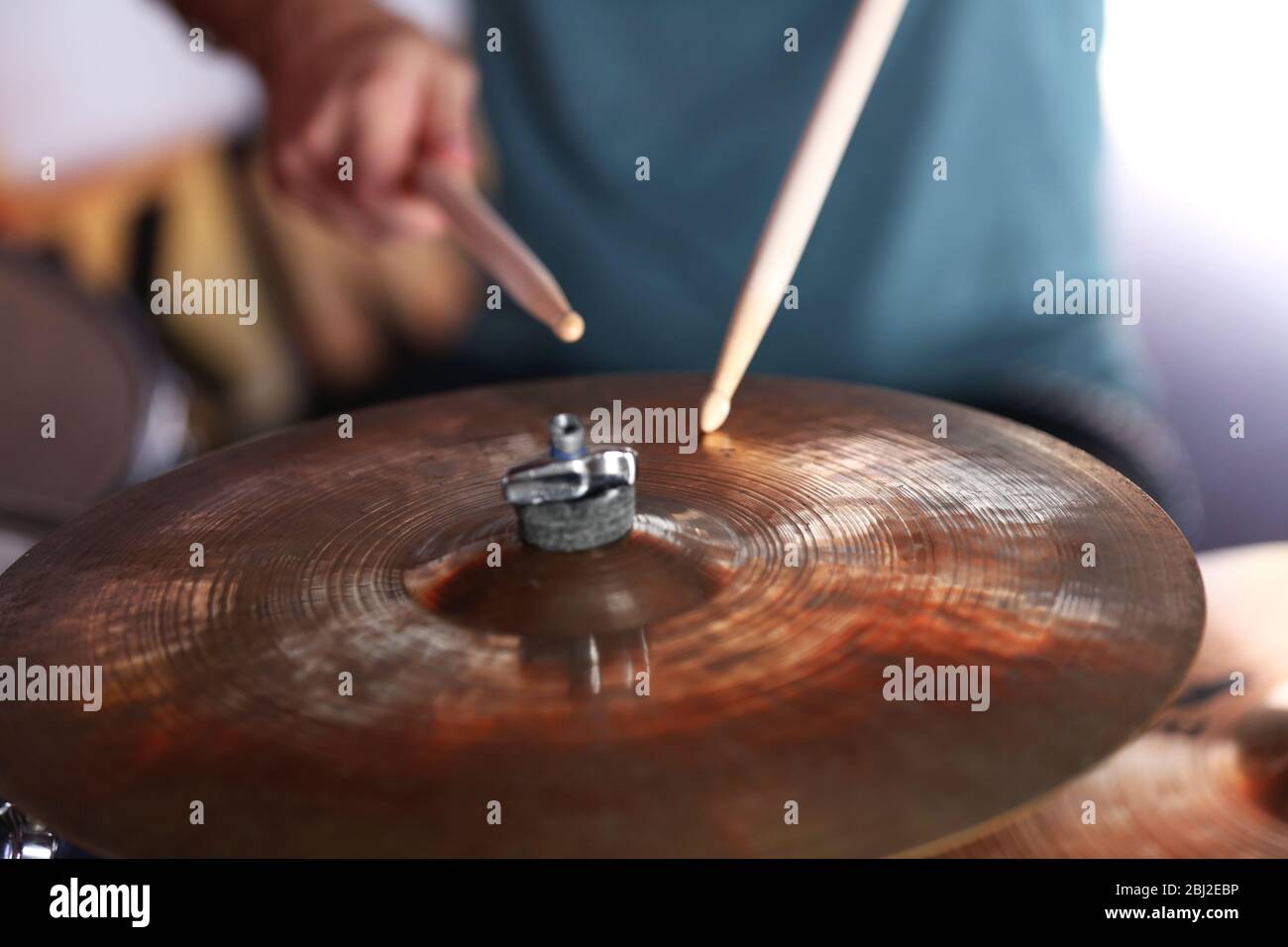 Hand of drummer with sticks and drums, close-up Stock Photo - Alamy