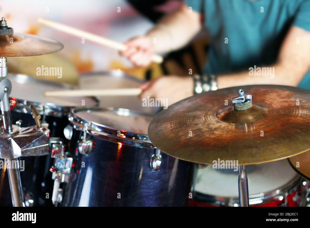 Hand of drummer with sticks and drums, close-up Stock Photo - Alamy