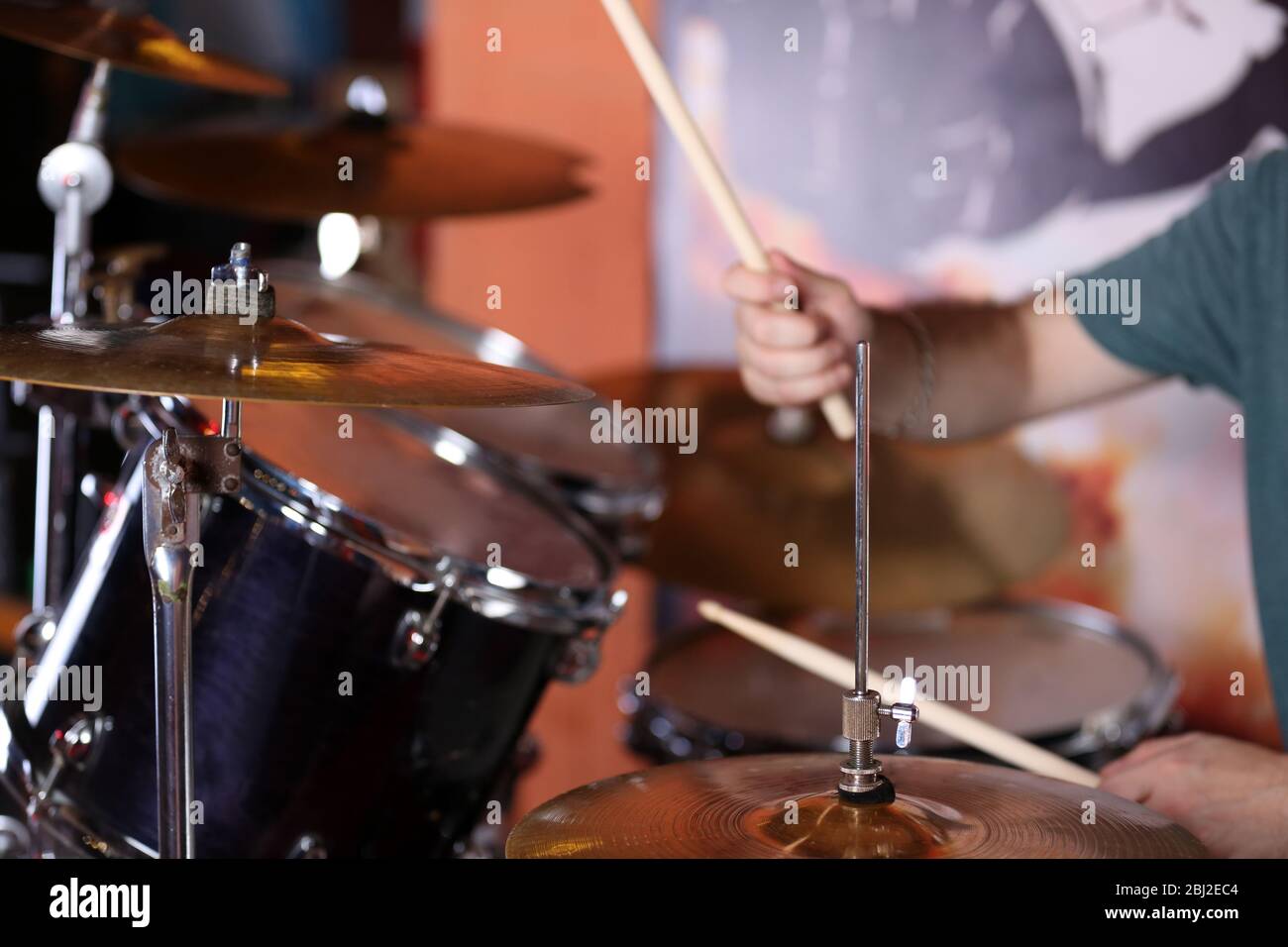 Hand of drummer with sticks and drums, close-up Stock Photo - Alamy
