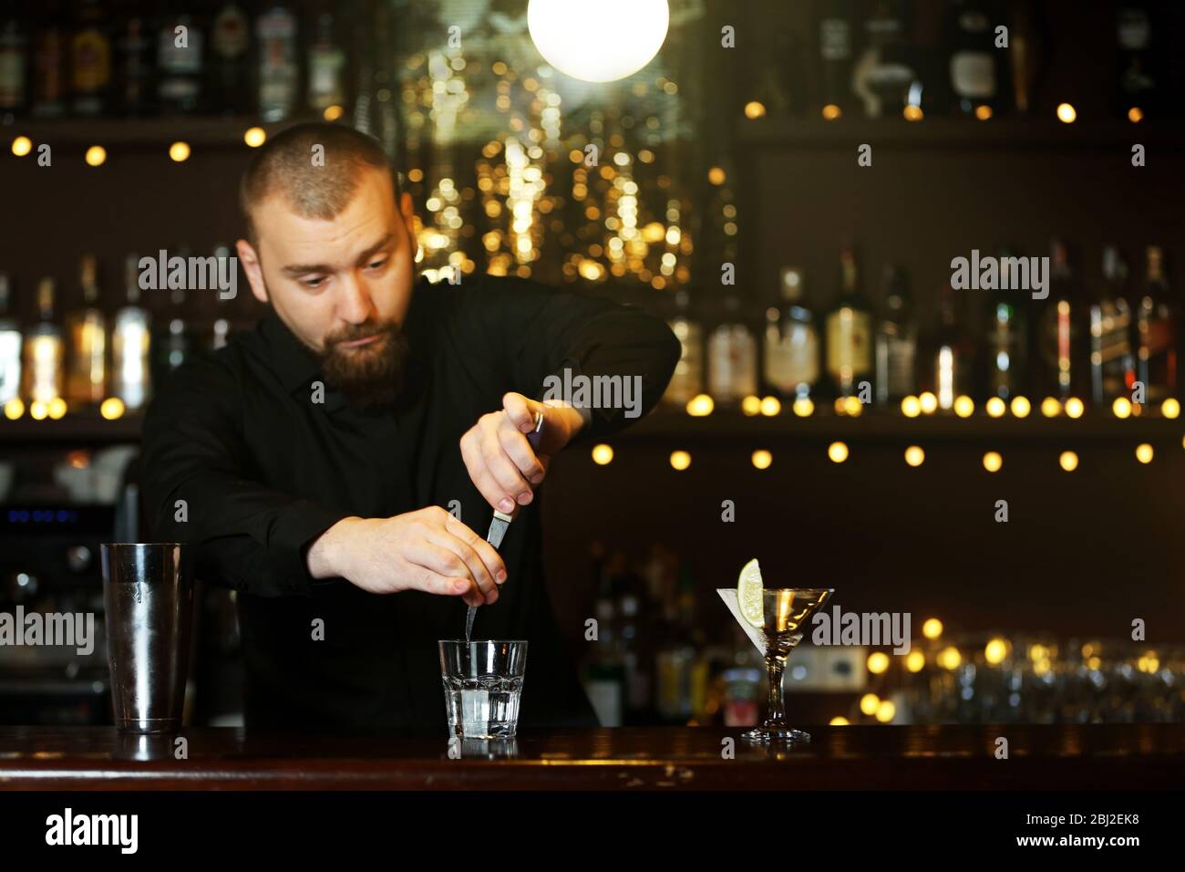 Bartender making cocktail Stock Photo - Alamy