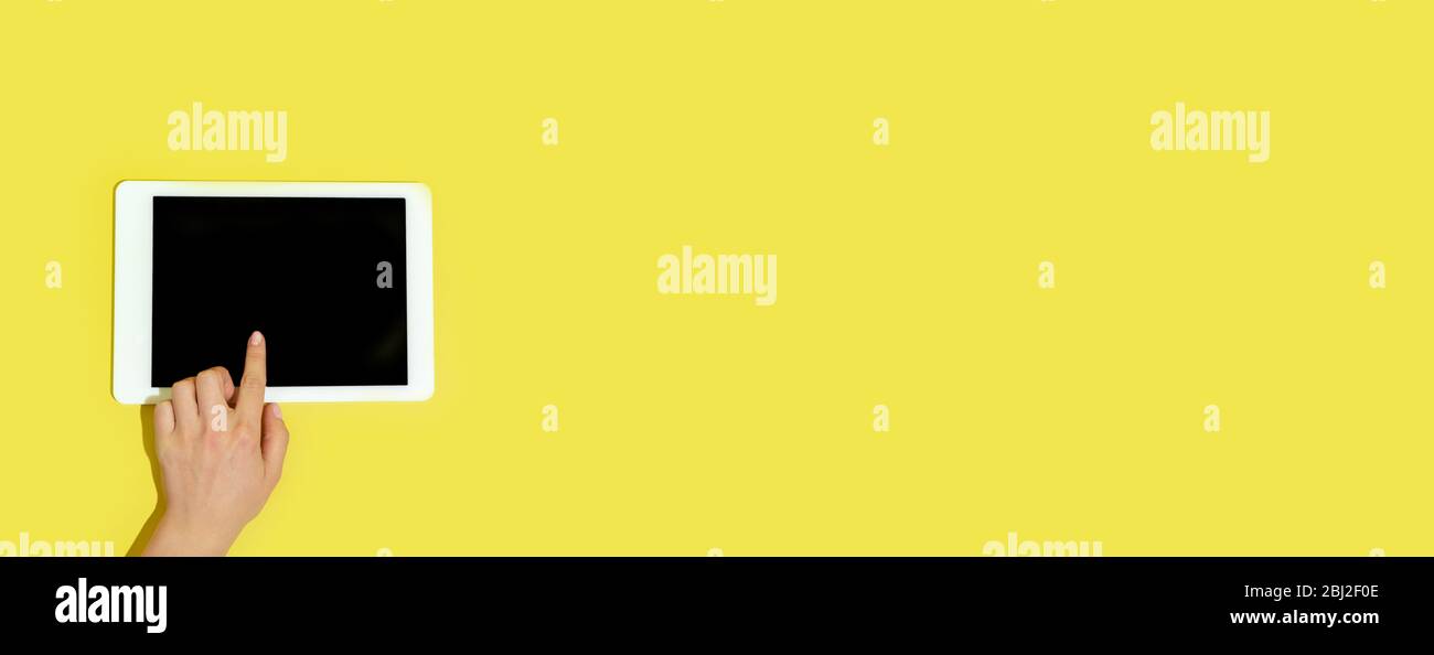 Hand using gadgets, tablet on top view, blank screen with copyspace ...