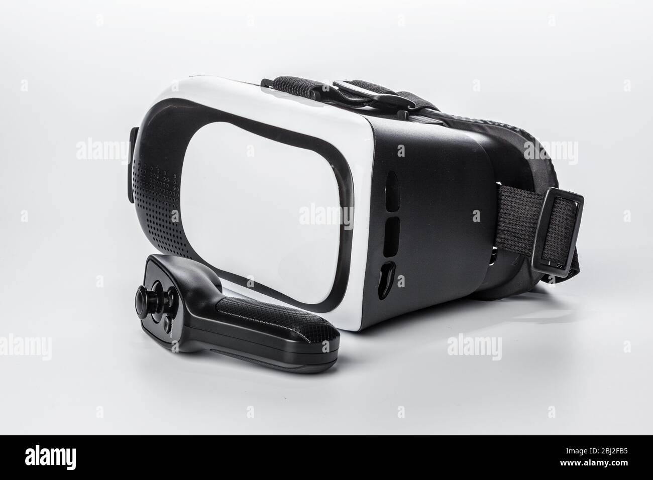 Virtual Reality glasses and game pad Isolated on white background Stock ...