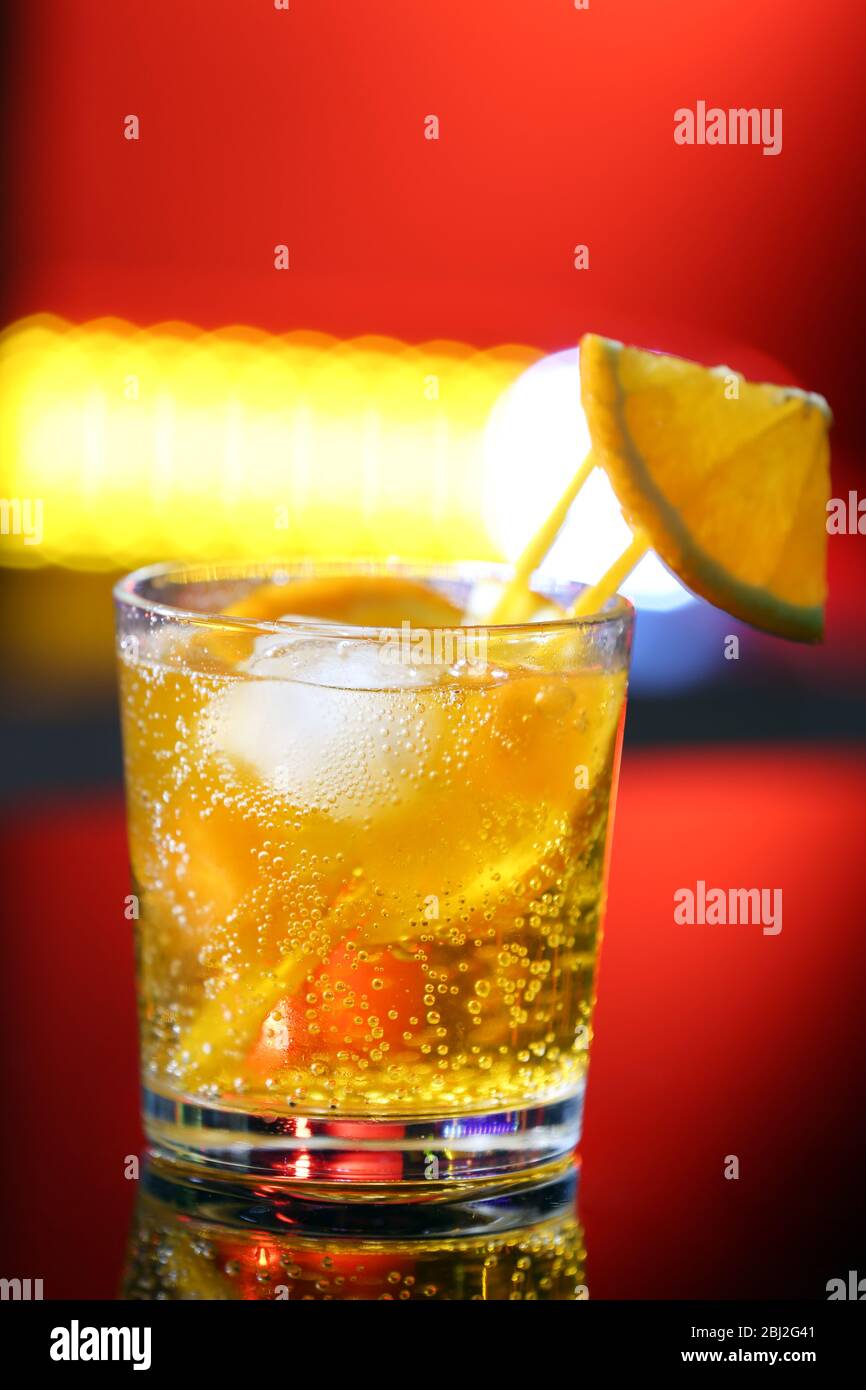 Glass of cocktail on bar background Stock Photo - Alamy