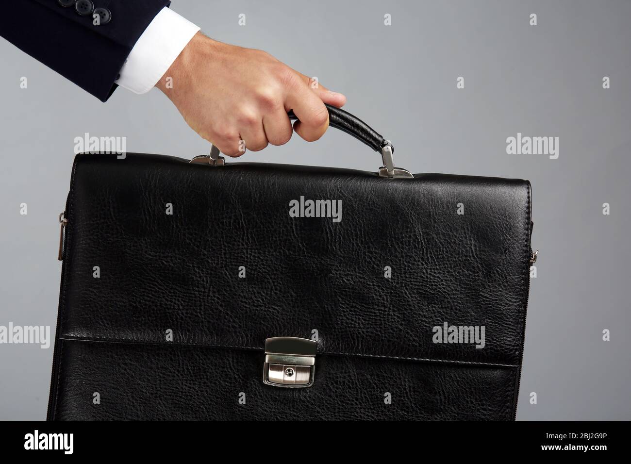 Hand holding briefcase hi-res stock photography and images - Alamy