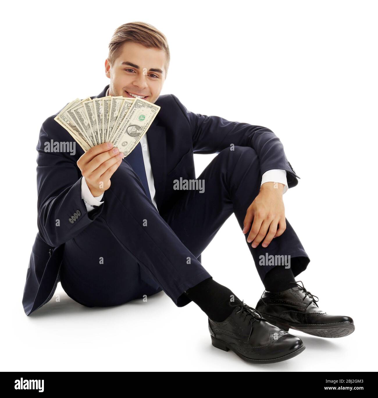 Elegant man in suit holding money isolated on white Stock Photo - Alamy