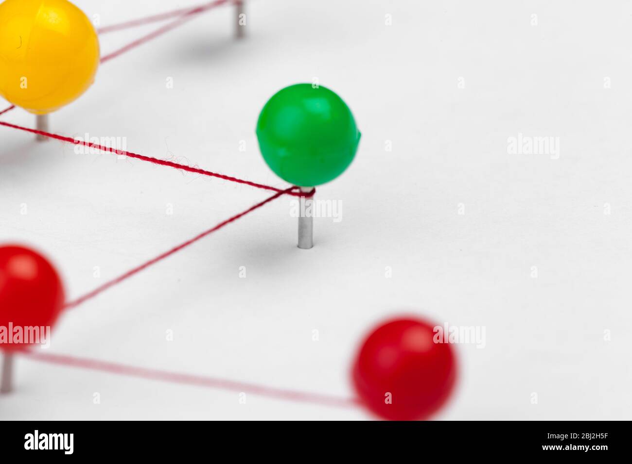 pins connected creating a network. Close up Stock Photo - Alamy