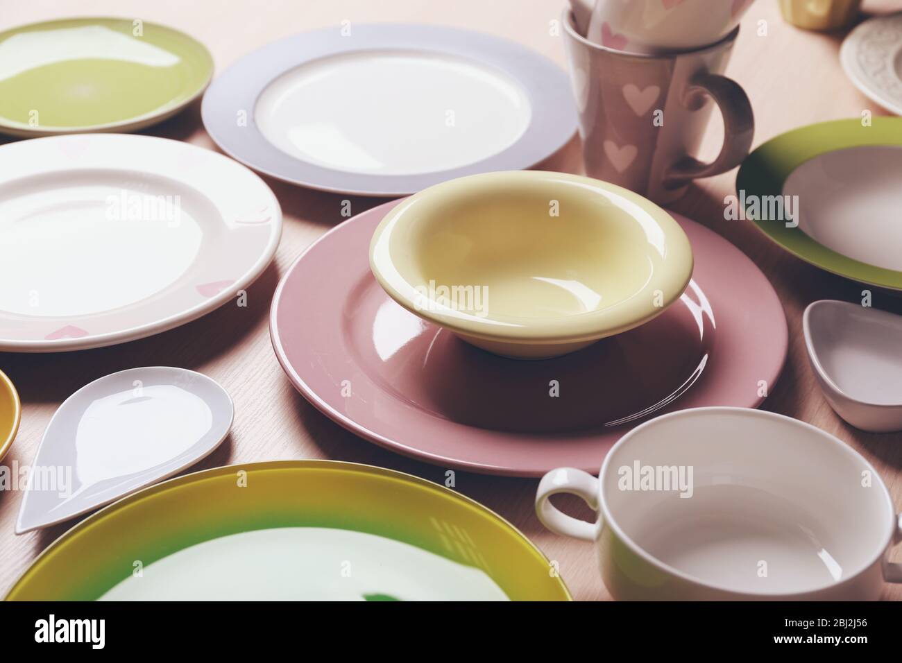 Set of different plates on the table Stock Photo - Alamy
