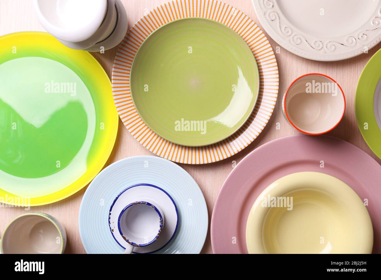 Set of different plates on the table Stock Photo - Alamy