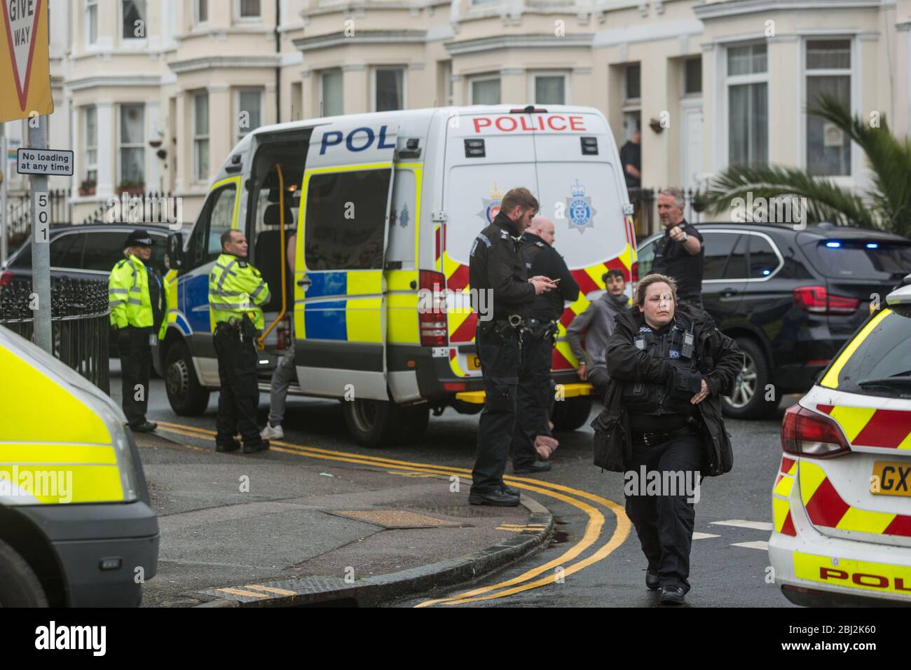 Eastbourne, England. 28 Apr 2020. Police stand by van with suspects ...